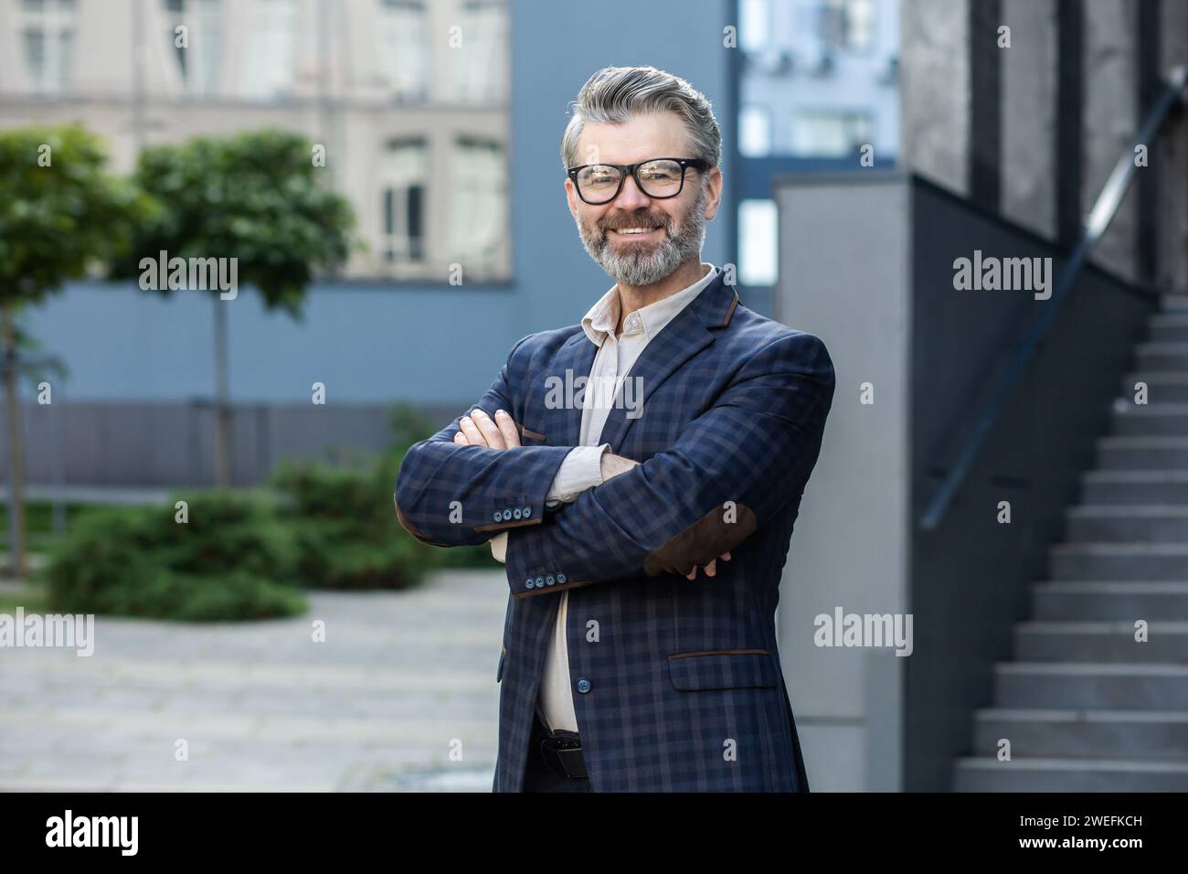Professional senior man in business attire smiling confidently outdoors ...
