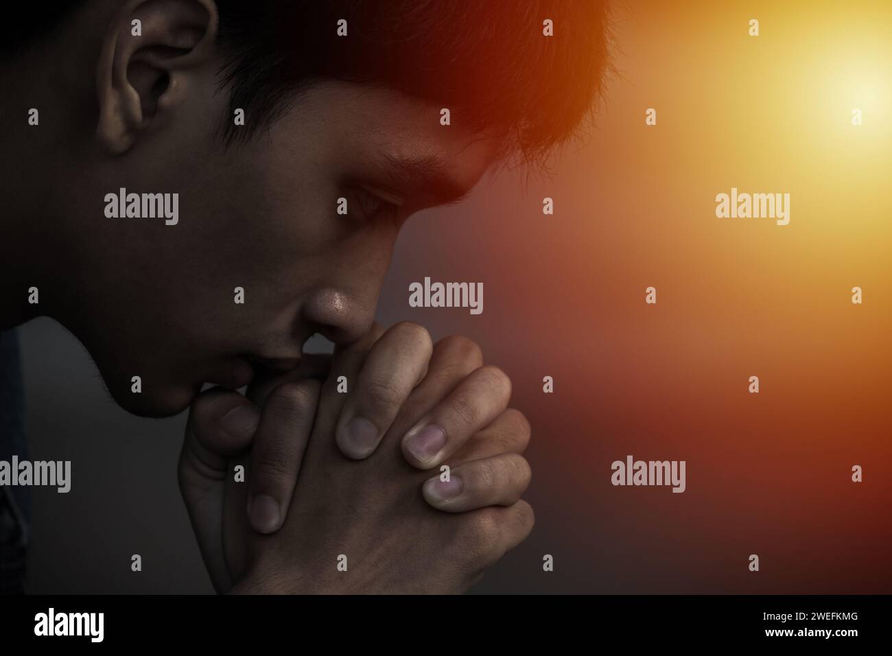 A man praying and close your eyes in praying. Prayer to pray. A young ...