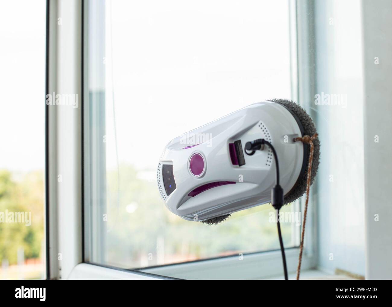 Clean windows safely with a window cleaning robot Stock Photo - Alamy