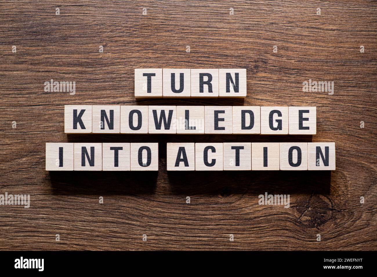Turn knowledge into action - word concept on building blocks, text Stock Photo - Alamy