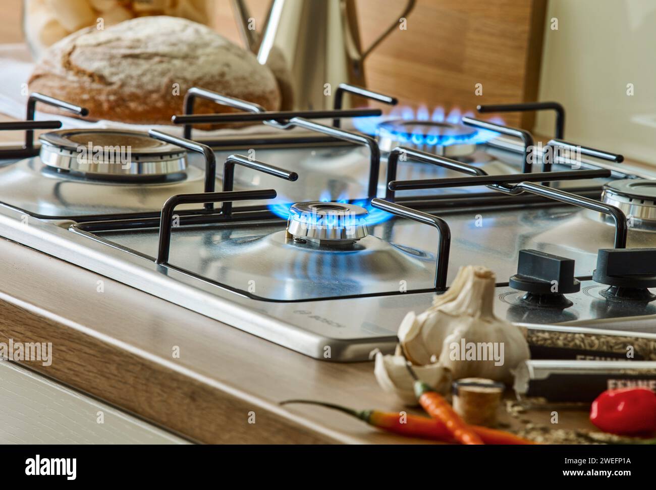 Gas hob with flames Stock Photo - Alamy