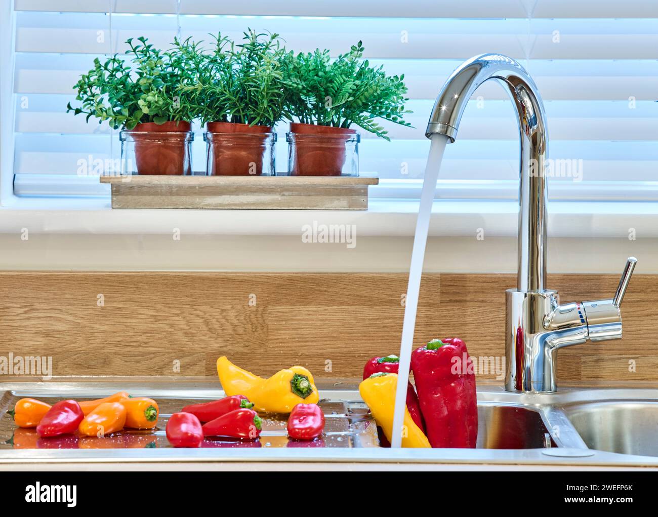 Kitchen sink tap with running water Stock Photo - Alamy