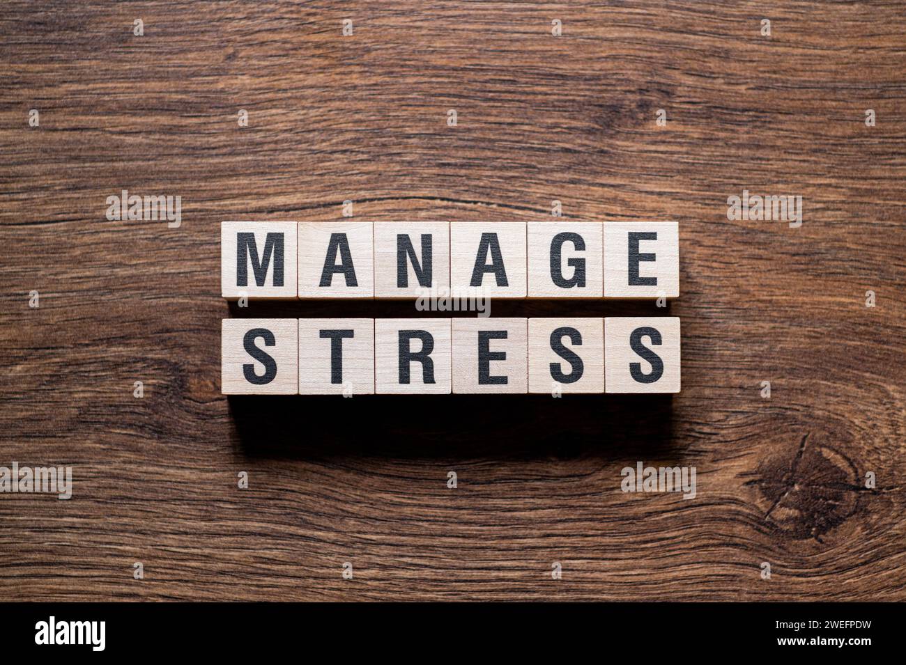 Manage stress - word concept on building blocks, text Stock Photo - Alamy