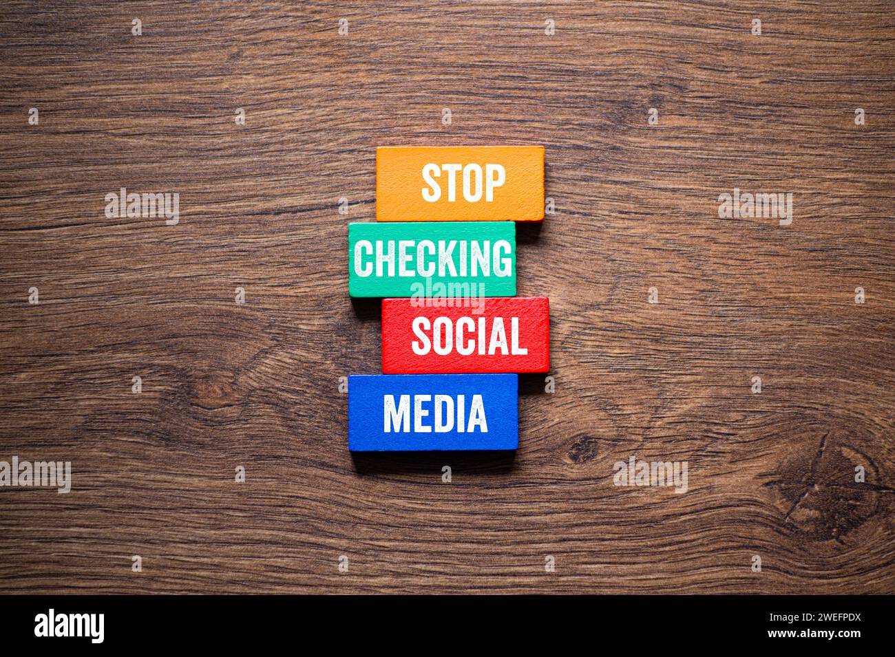 Stop checking social media - word concept on building blocks, text ...