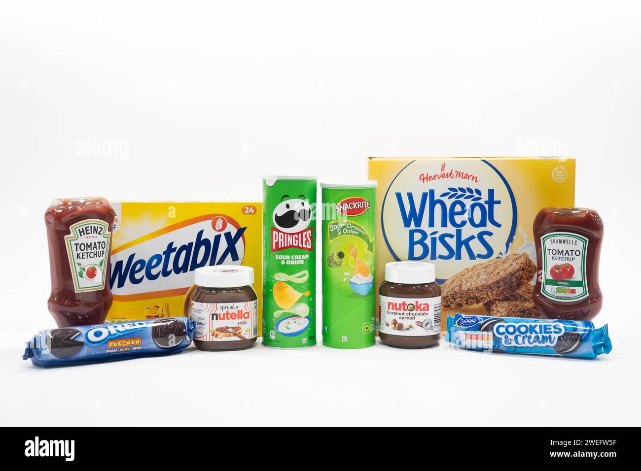 A line-up of well-known consumer products Heinz tomato ketchup, sour ...