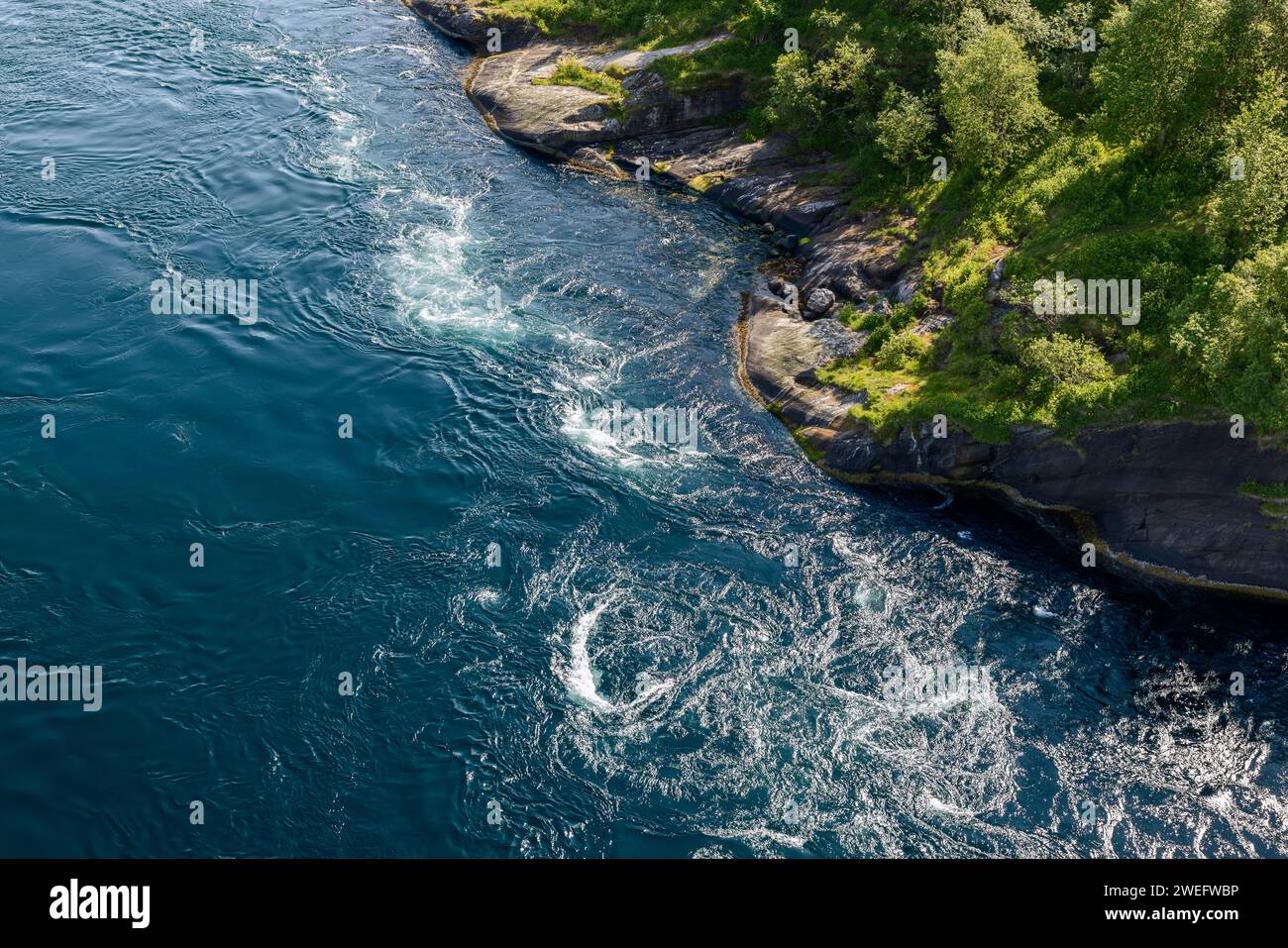 Aerial view of Saltstraumen's fierce tidal currents carving through the ...
