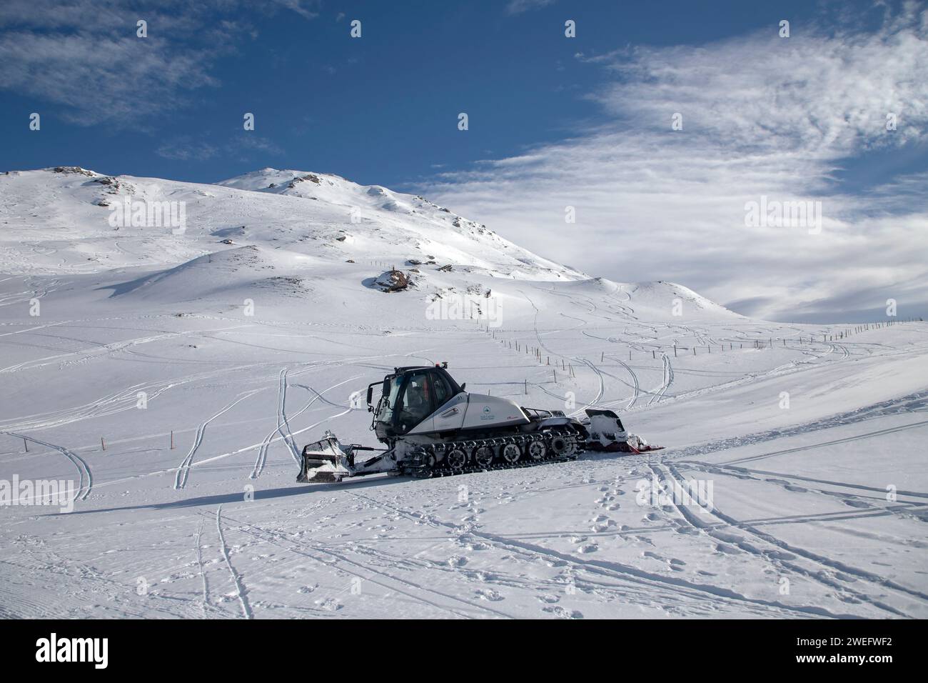 A ratrak operating at Mont-Cenis, a massif in the French Alps Stock ...