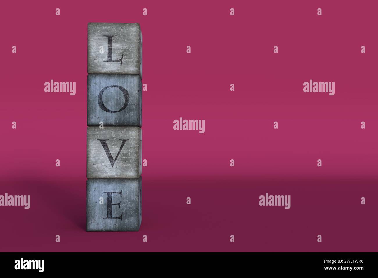 Wooden blocks spelling LOVE on a pink studio background. Valentines Day ...