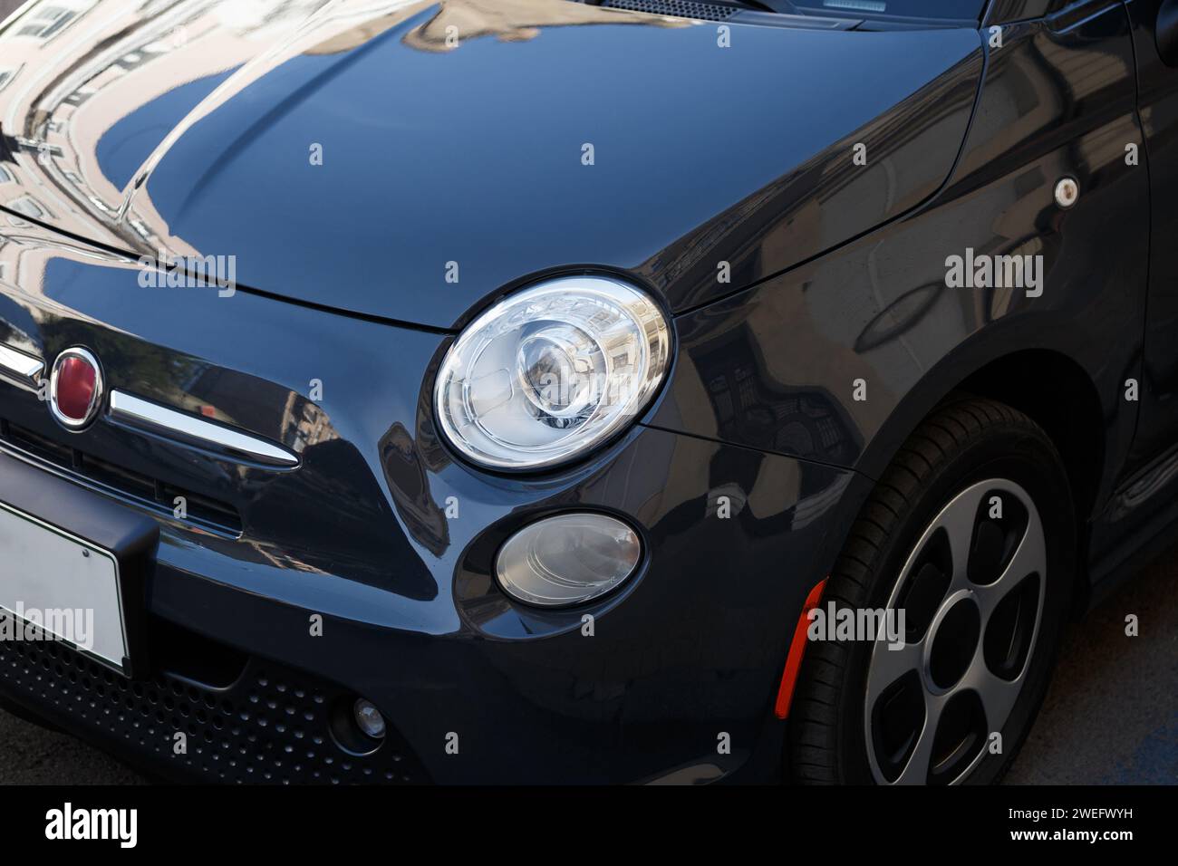 Headlights and front wheel of a modern car close-up, elegant auto ...