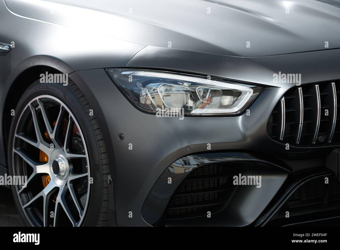 Headlights and front wheel of a modern car close-up, elegant auto ...