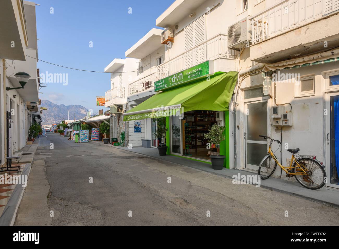 Kos, Greece - May 12, 2023: Greek street with shops in the coastal ...