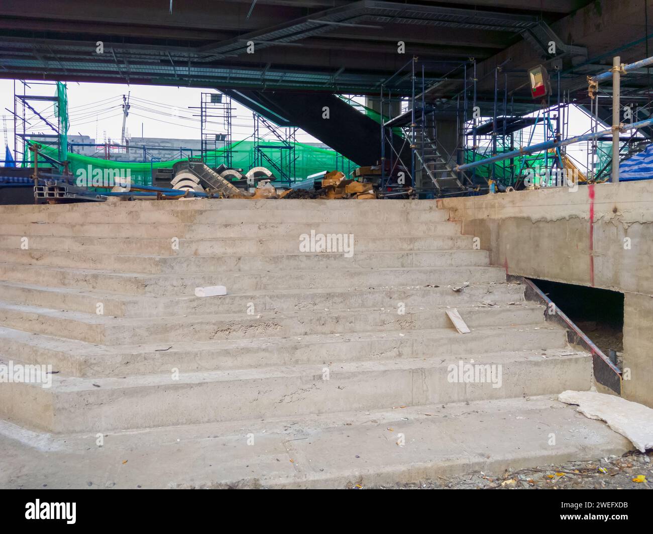The unfinished concrete staircase of the entrance to the monorail ...