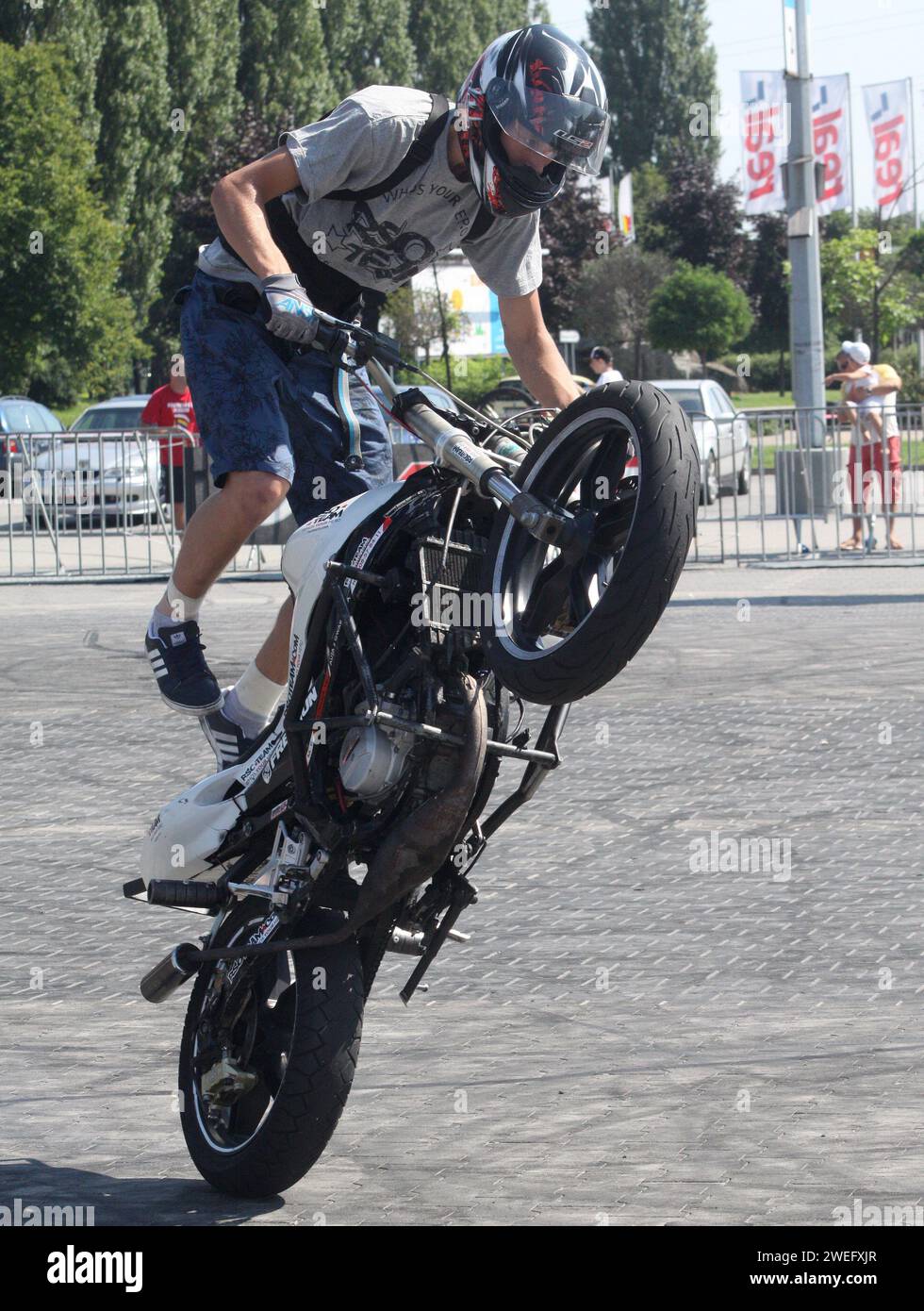 Cracow. Krakow. Poland.Young motorbiker performing stunts on his tuned ...