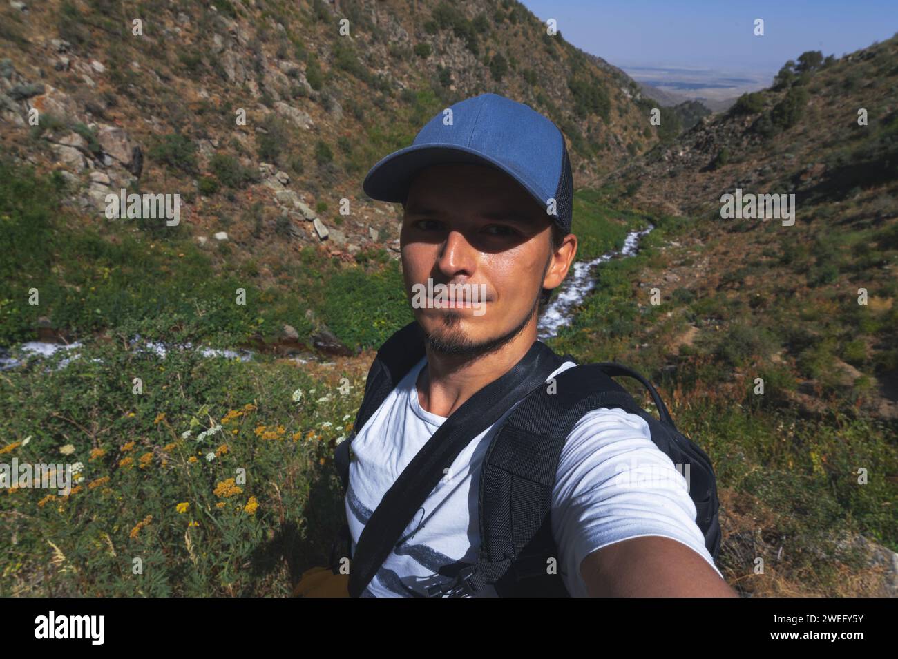 Selfie of a white Caucasian male tourist with a beard on a hike in the ...