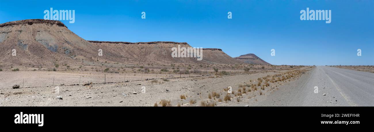 landscape with C12 gravel road and conglomerate and basalt slopes on ...