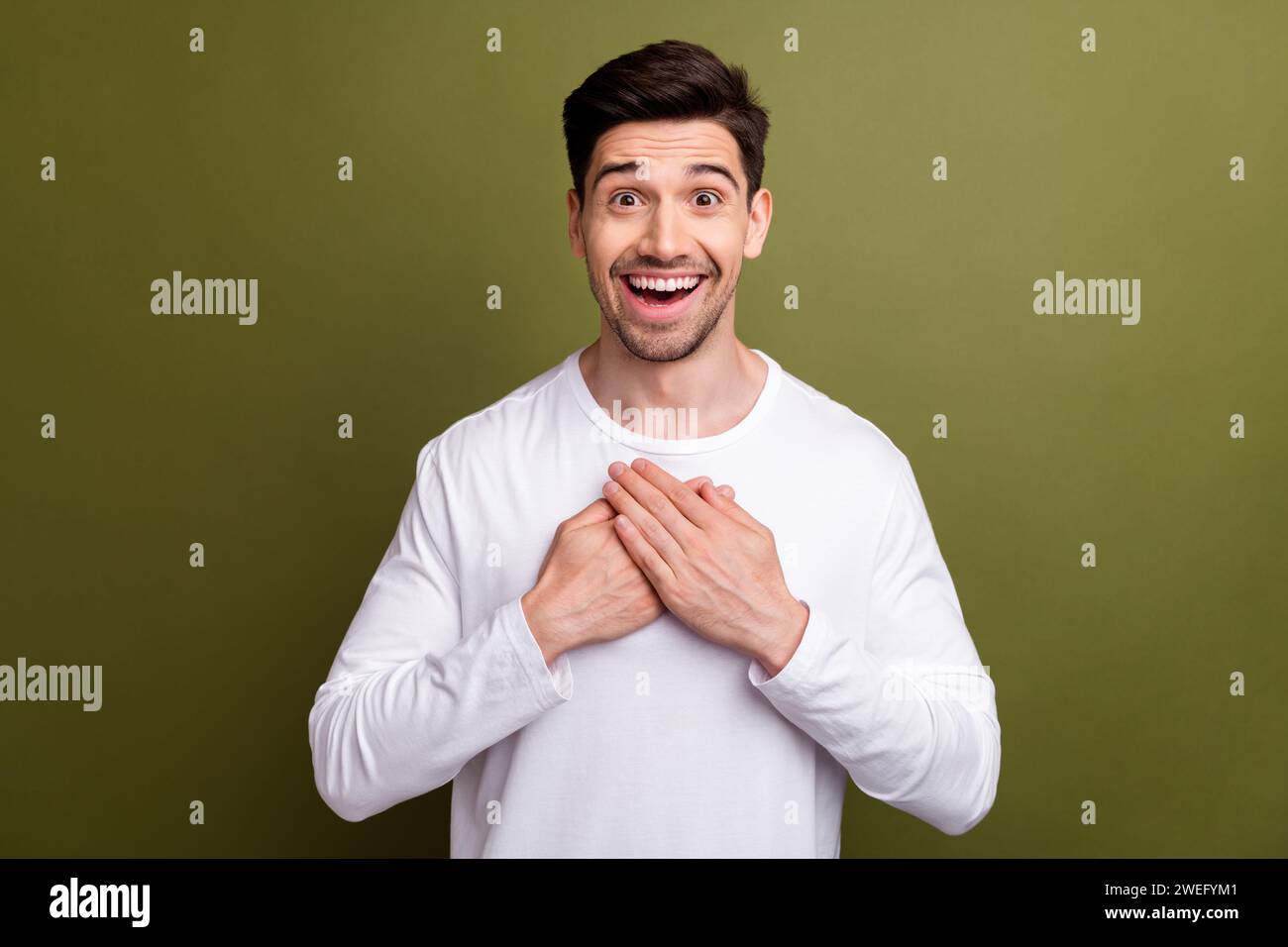 Portrait photo of handsome young funny man touch chest amazed grateful ...