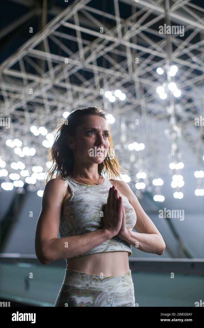 yoga meditation pose under light bulbs Stock Photo - Alamy
