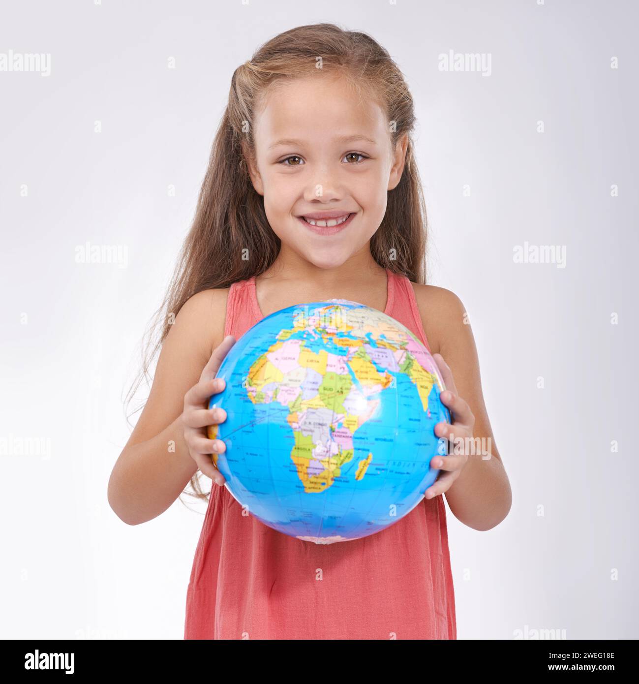 Child, portrait and globe in studio with world, planets and city for ...