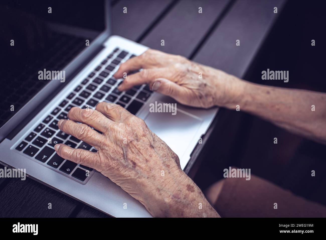old persons hands on computer keyboard Stock Photo - Alamy
