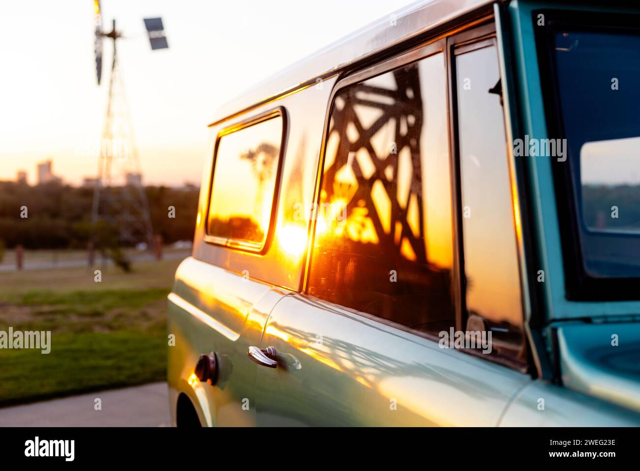 Sunset behind car on roadside Stock Photo - Alamy