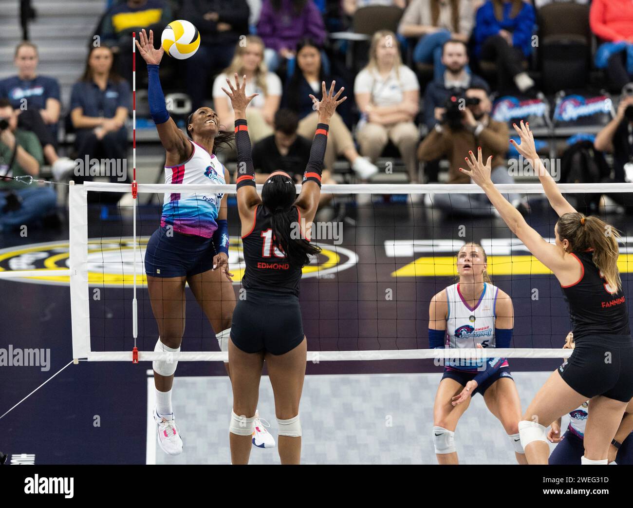 Omaha Supernovas' Nia Kai Reed, left, hits against Atlanta Vibe's Leah ...