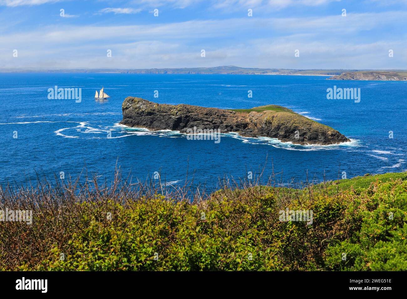 A sailing boat around Mullion Island, Mullion Cove, Lizard Peninsula ...