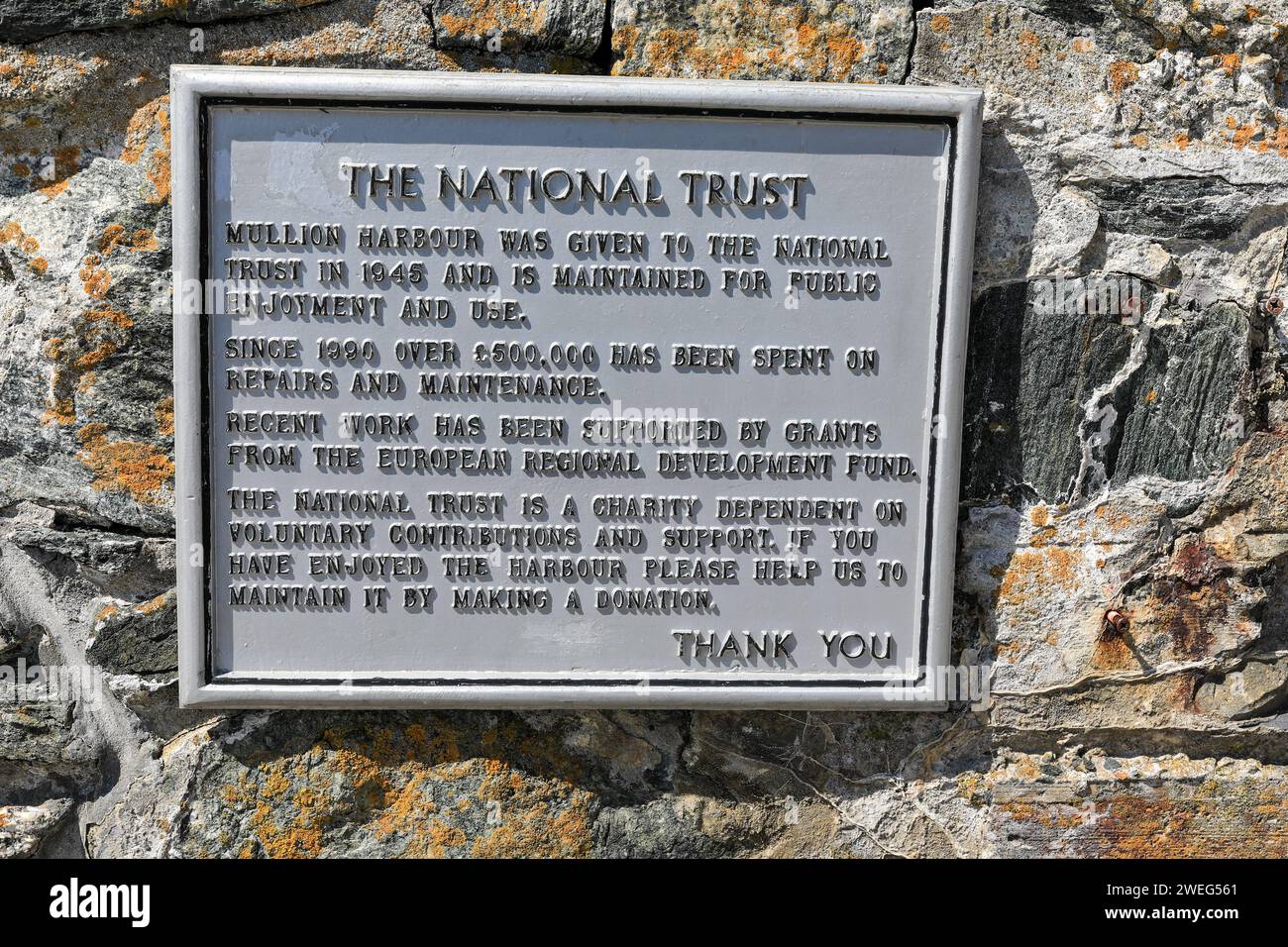 A National Trust sign or information board at Mullion Cove Harbour ...