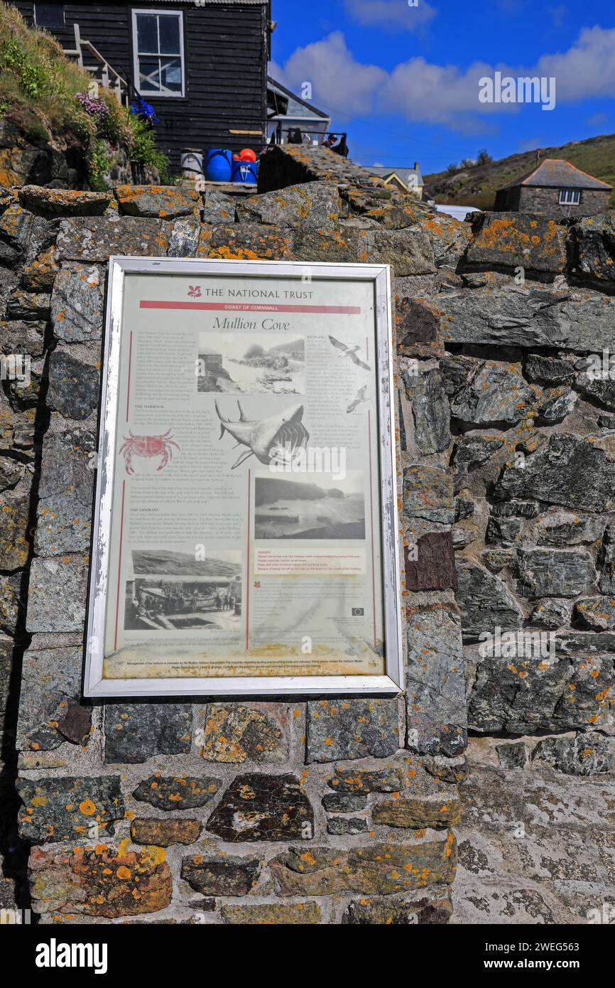A National Trust sign or information board at Mullion Cove Harbour ...