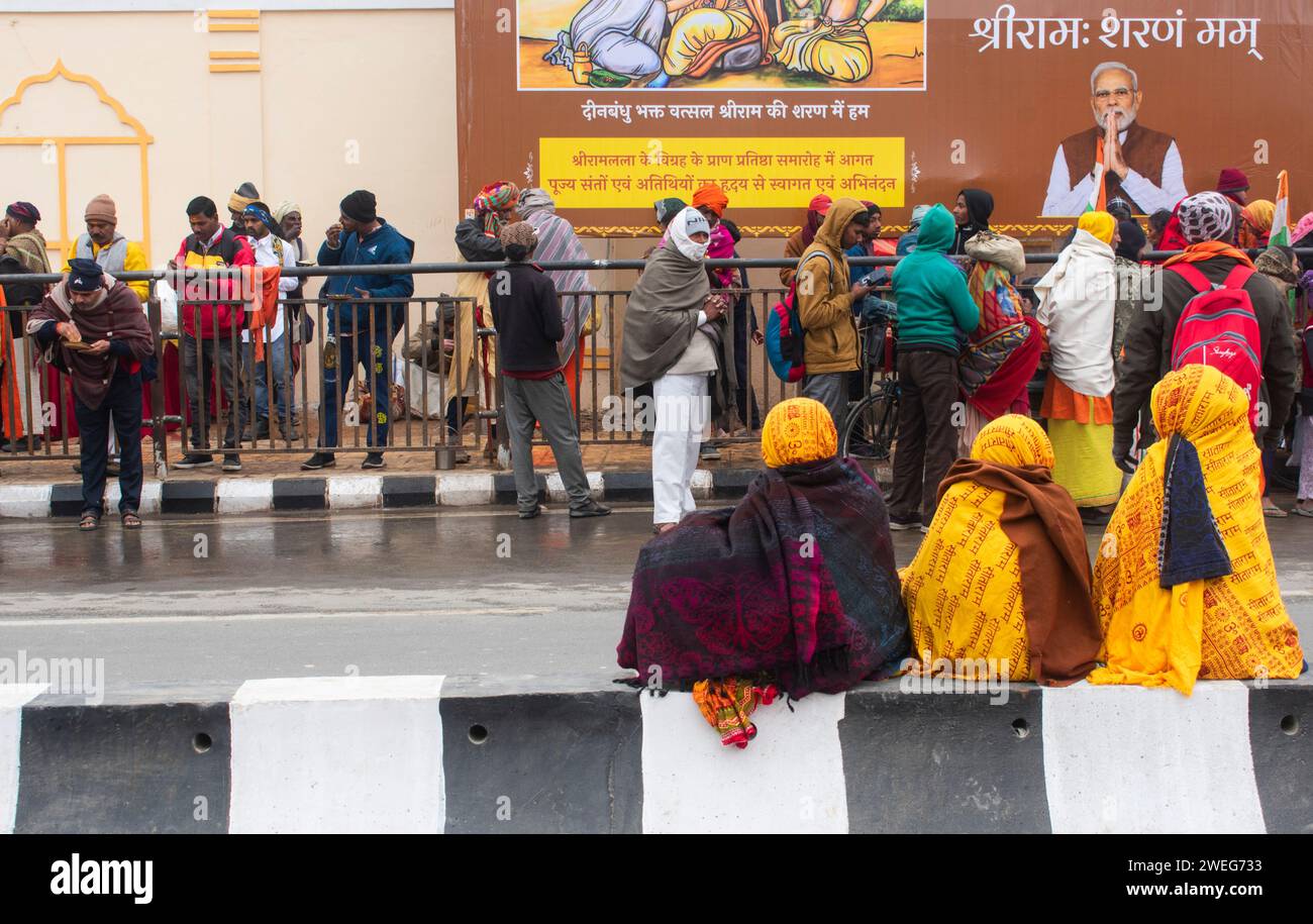 Devotees arrives at Ayodhya, on the eve of consecration ceremony of the Ram temple, in Ayodhya ...