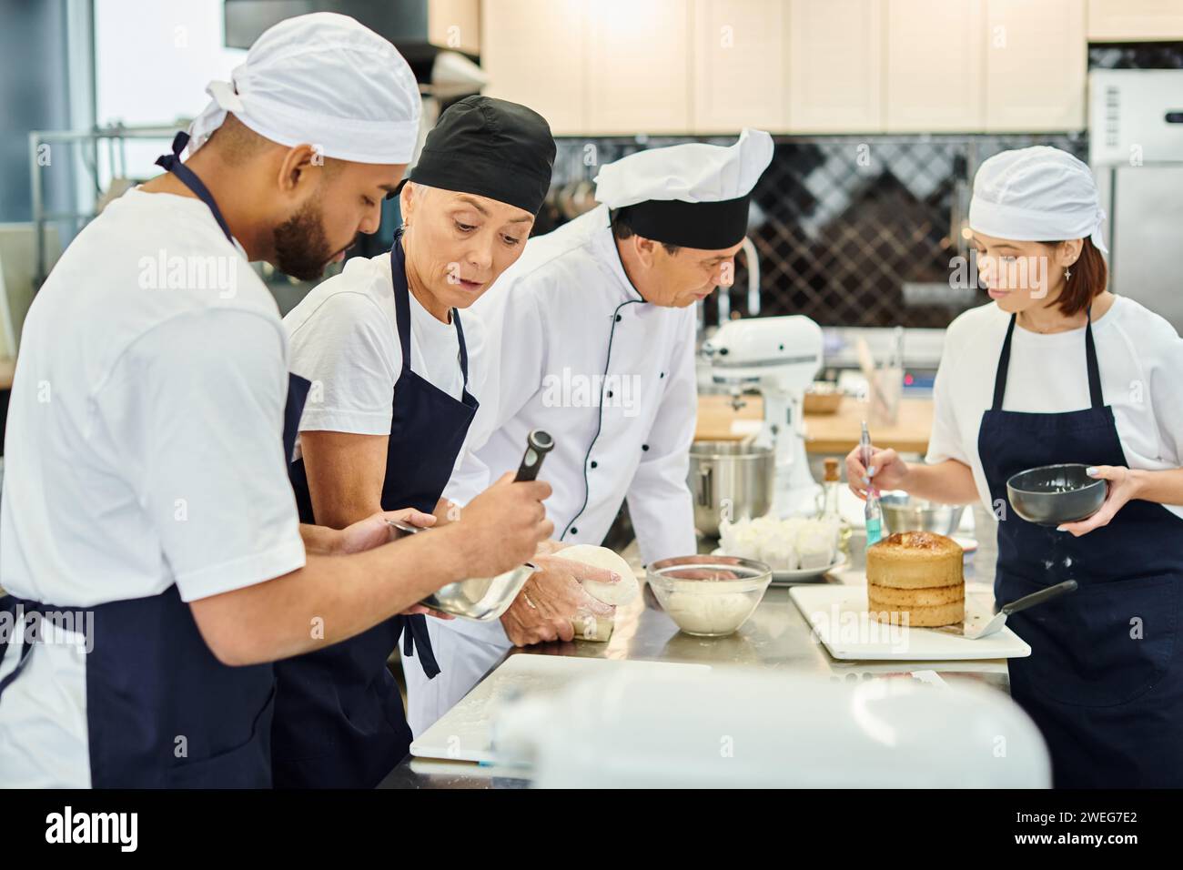 multicultural chefs in blue aprons and toques working hard on their ...