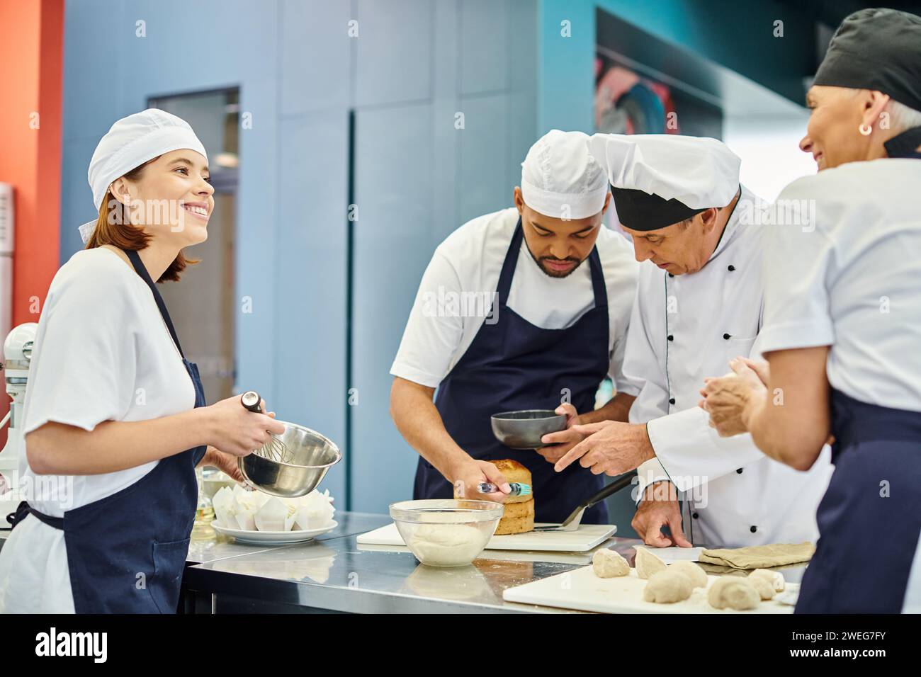 cheerful chefs smiling next to their african american colleague and ...