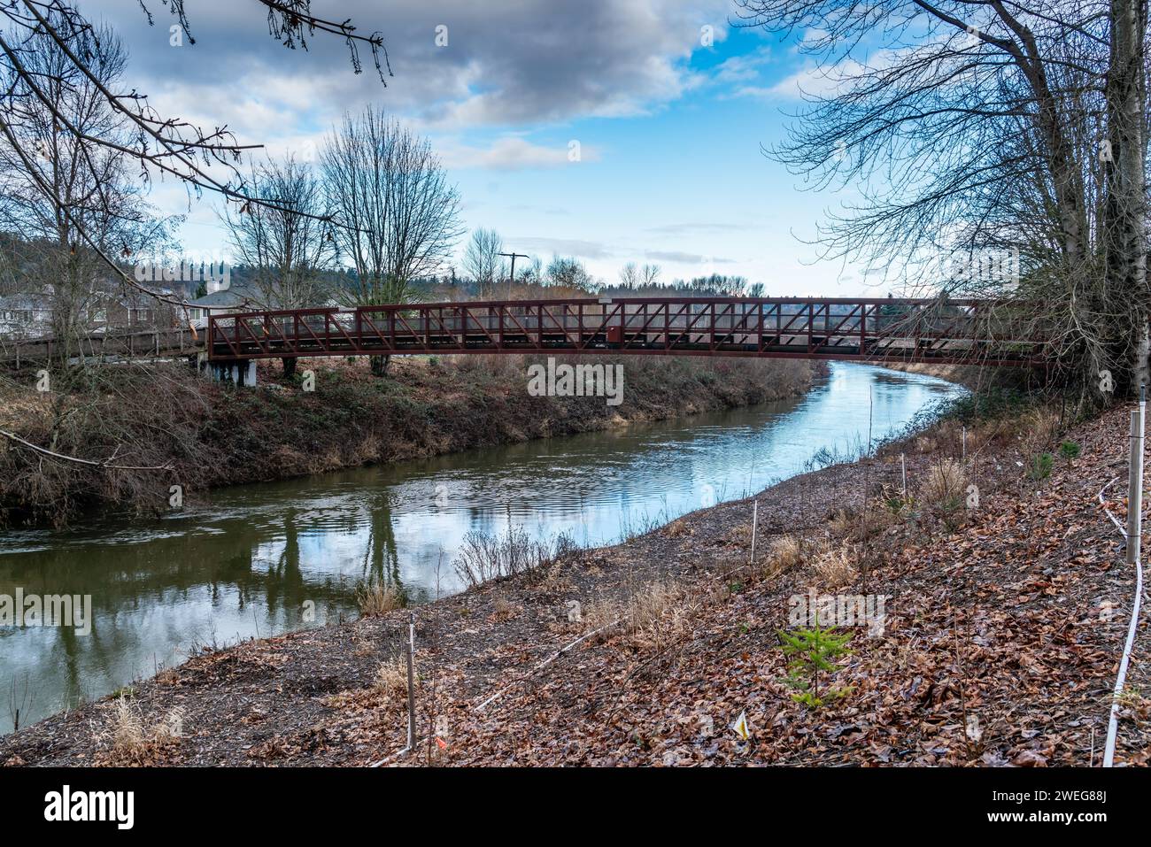 An old metal bridge spans the Green River in Kent, Washington Stock ...