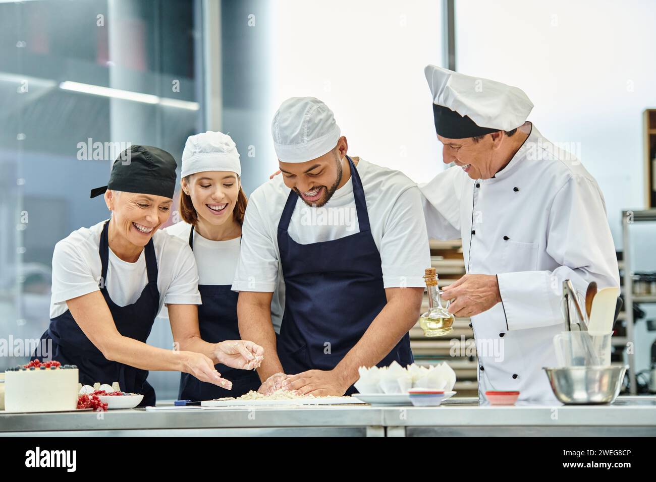 jolly good looking chefs working with dough together next to their ...