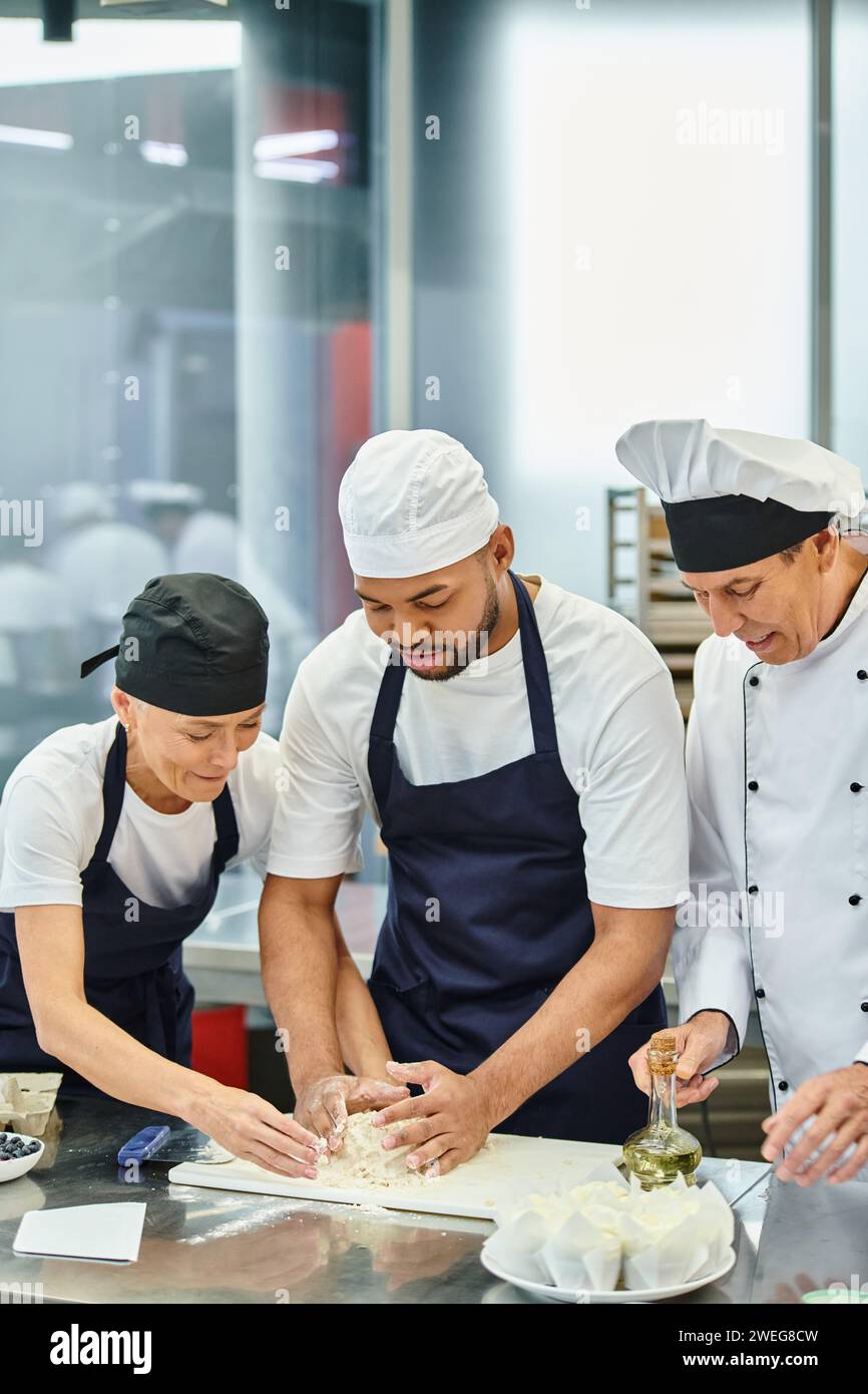 handsome african american chef working with dough while his friend and ...