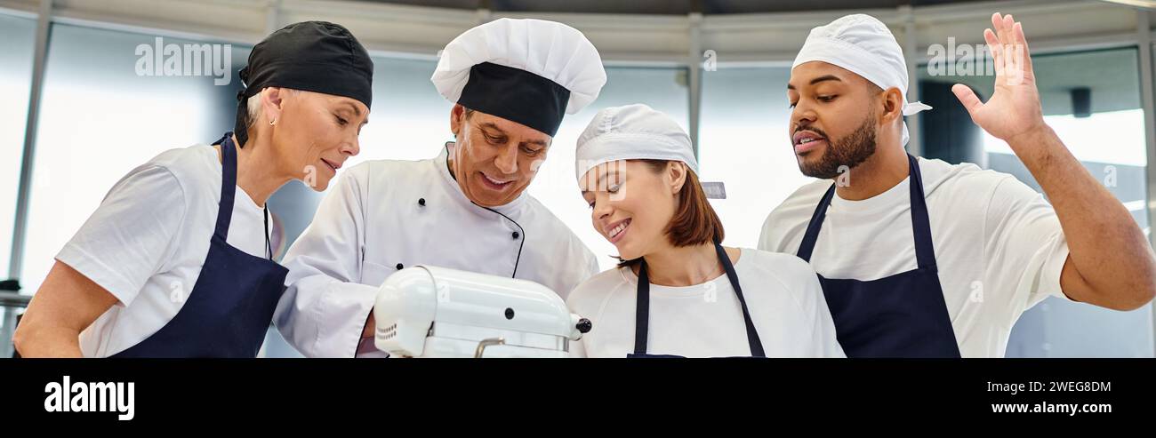 cheerful diverse chefs watching their chief cook showing how to use ...