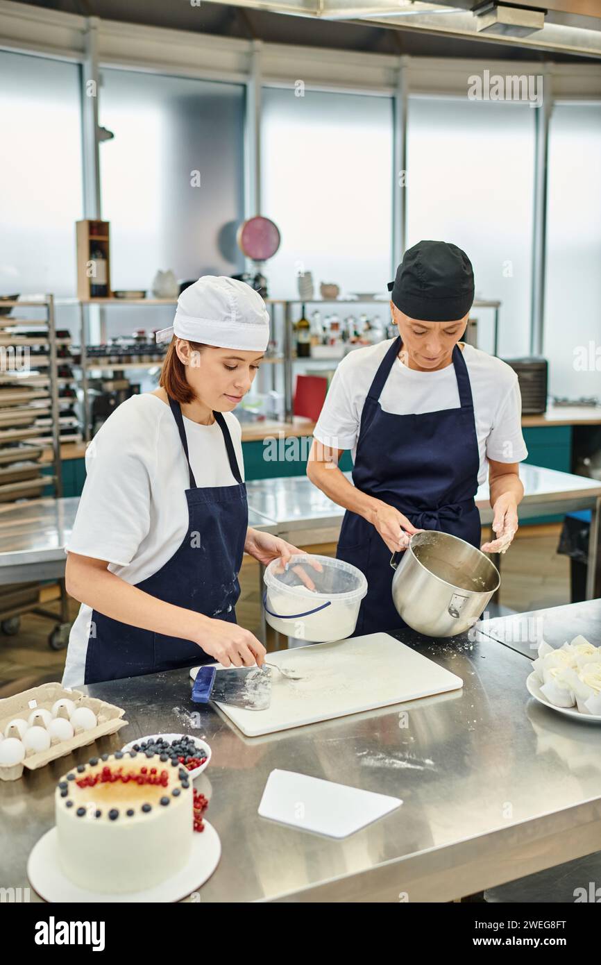good looking female chefs in blue aprons and toques working with dough ...