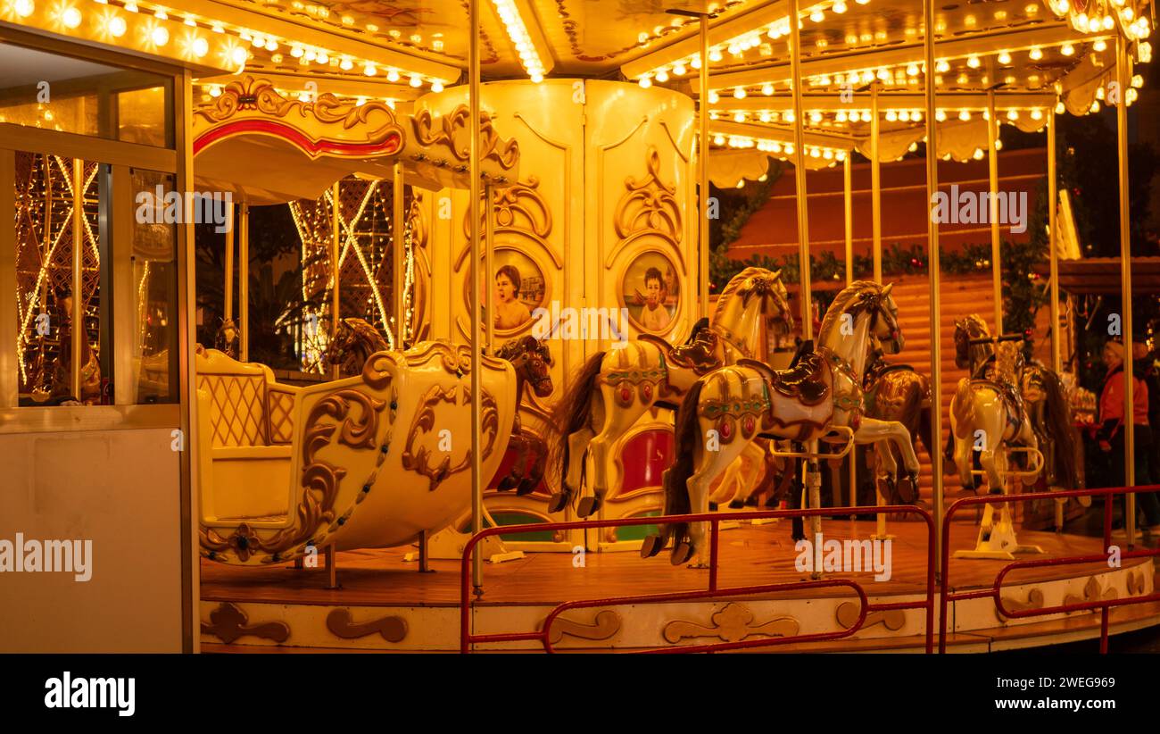 Colorful carousel illuminated with lights at night Stock Photo - Alamy