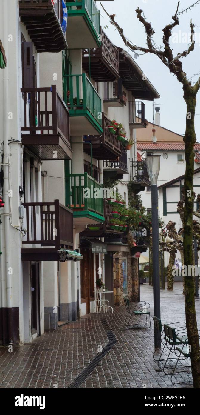 People strolling beside buildings in the rain Stock Photo - Alamy