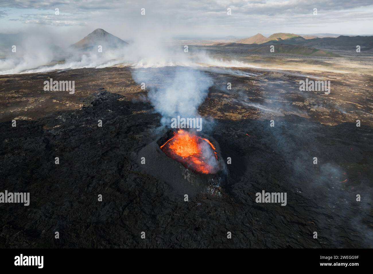 Volcano eruption in Iceland, summit crater, gas expulsion, and molten ...