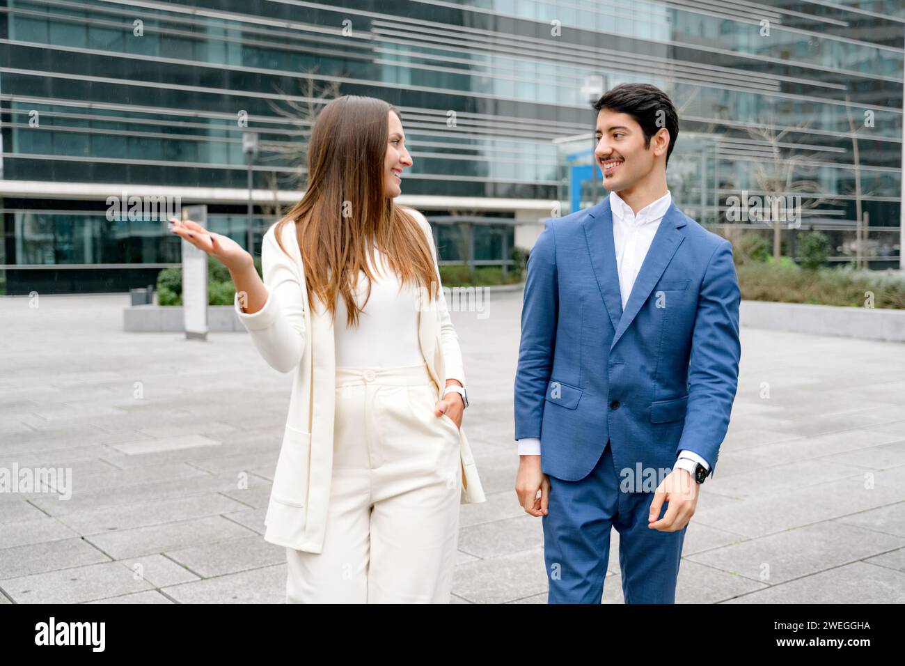 In an outdoor business setting, a professional Hispanic businessman ...