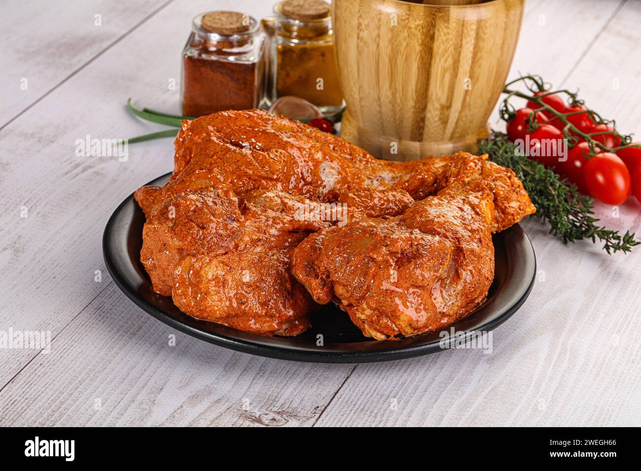 Raw turkey shoulder wing in Indian tandoori marinade spices Stock Photo ...