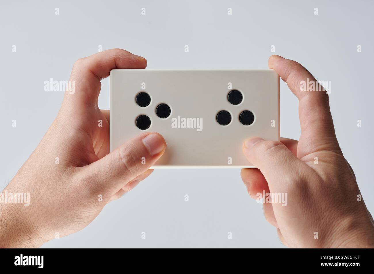 Simple remote controller for RC in hands isolated on white studio ...