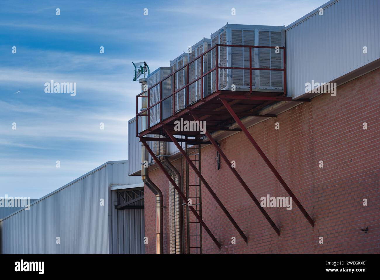 air conditioning units on a support outside the wall of an industrial ...