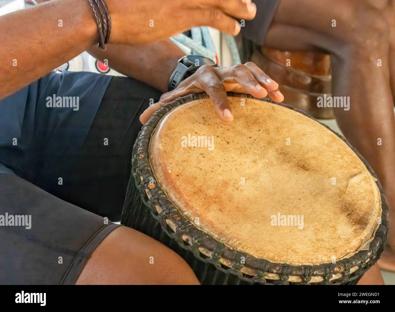 Hands playing an African drum Stock Photo - Alamy