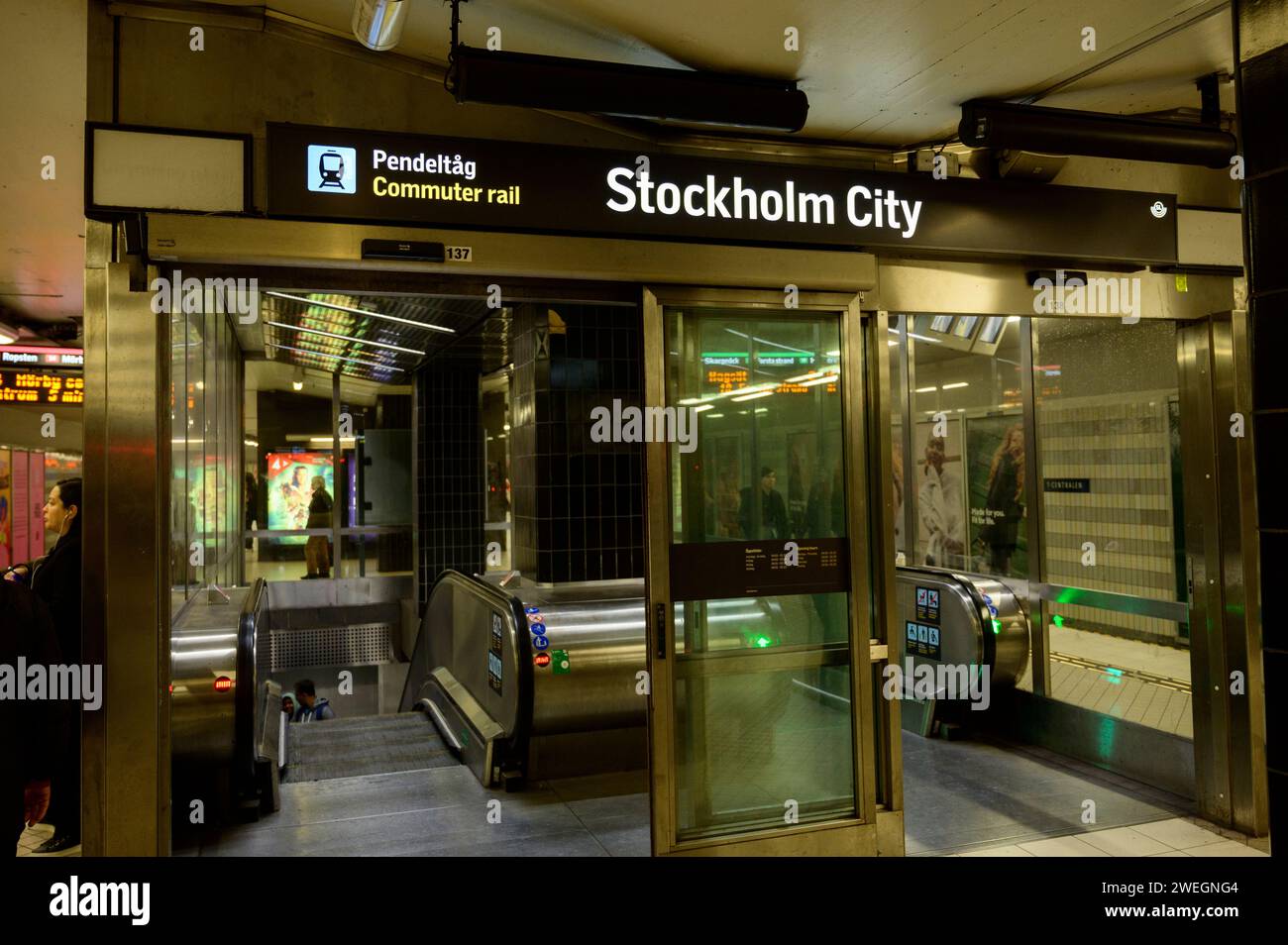 Signs in Stcokholm city metro station with doors to escalators Stock ...