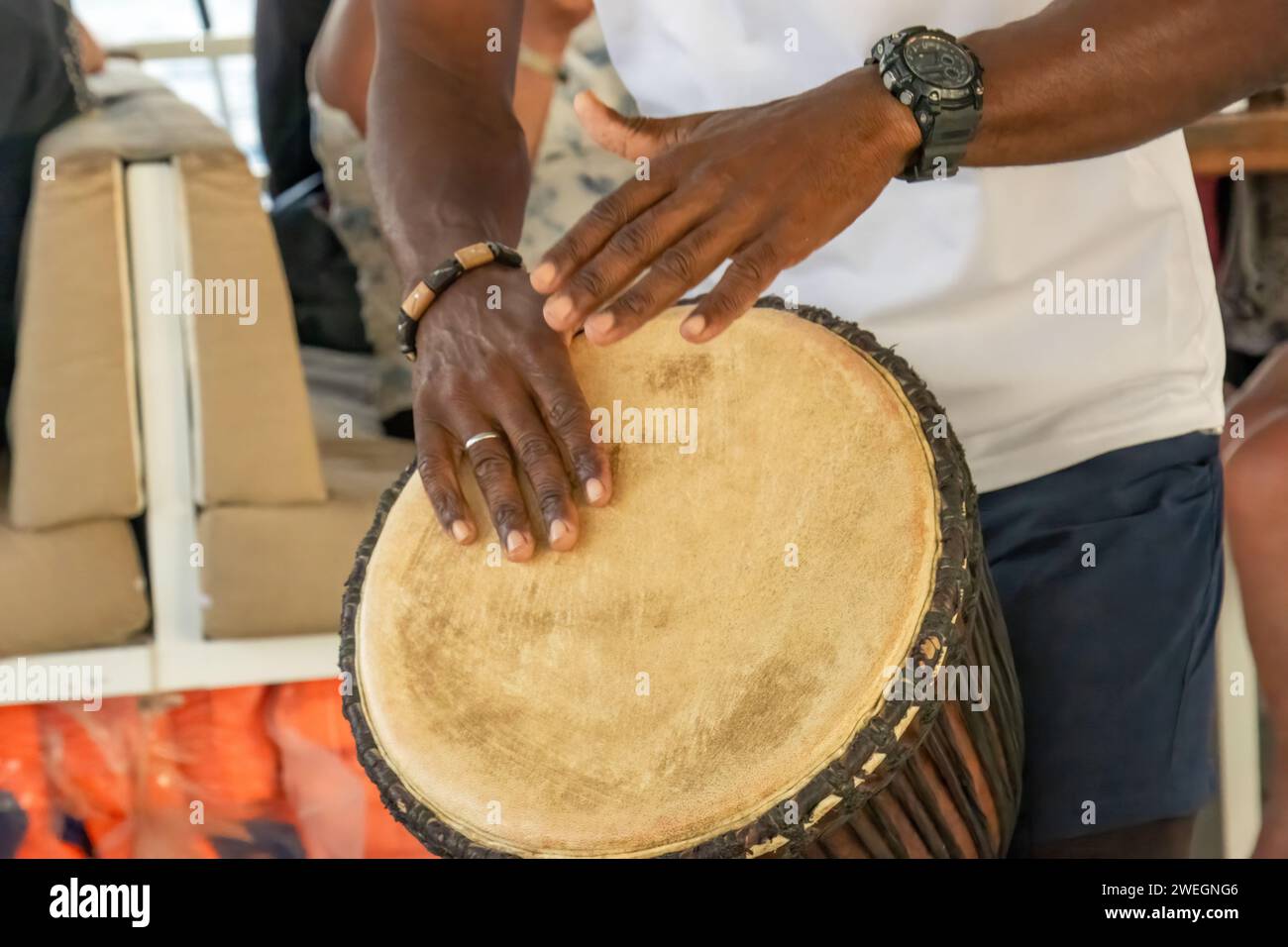 Hands playing an African drum Stock Photo - Alamy