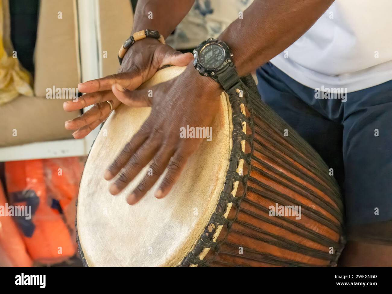 Hands playing an African drum Stock Photo - Alamy