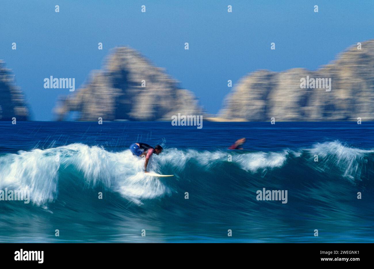 Surfing with El Arco in the background, Cabo San Lucas, Baja California ...
