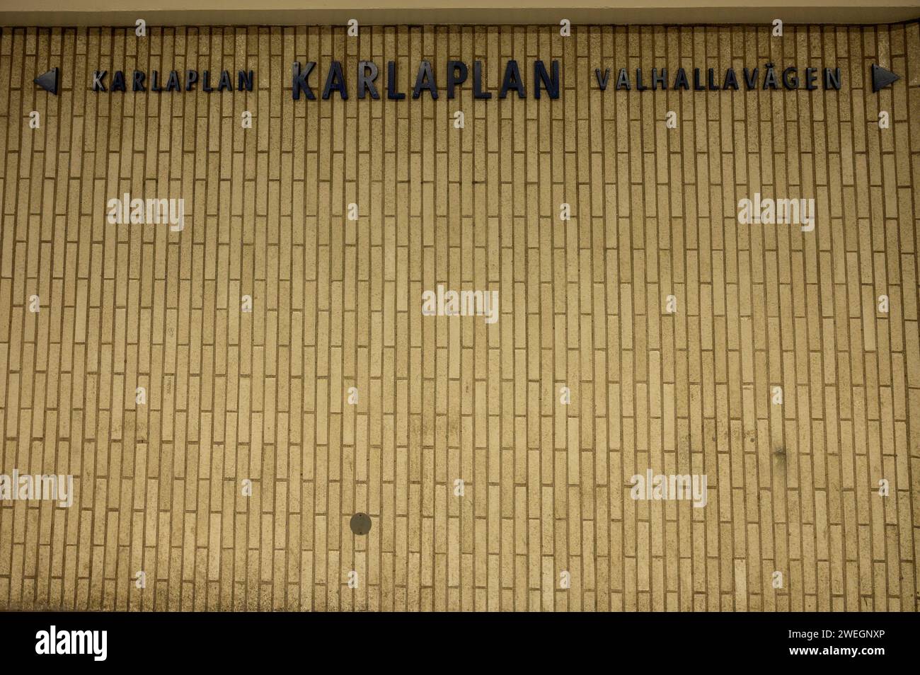 Tiles with text in Stckholm metro station Karlaplan directing to the ...