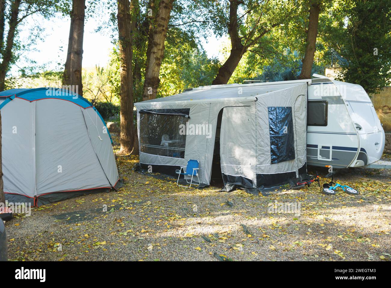 Tents setup for a group camping at the green grass meadow. Multiple ...